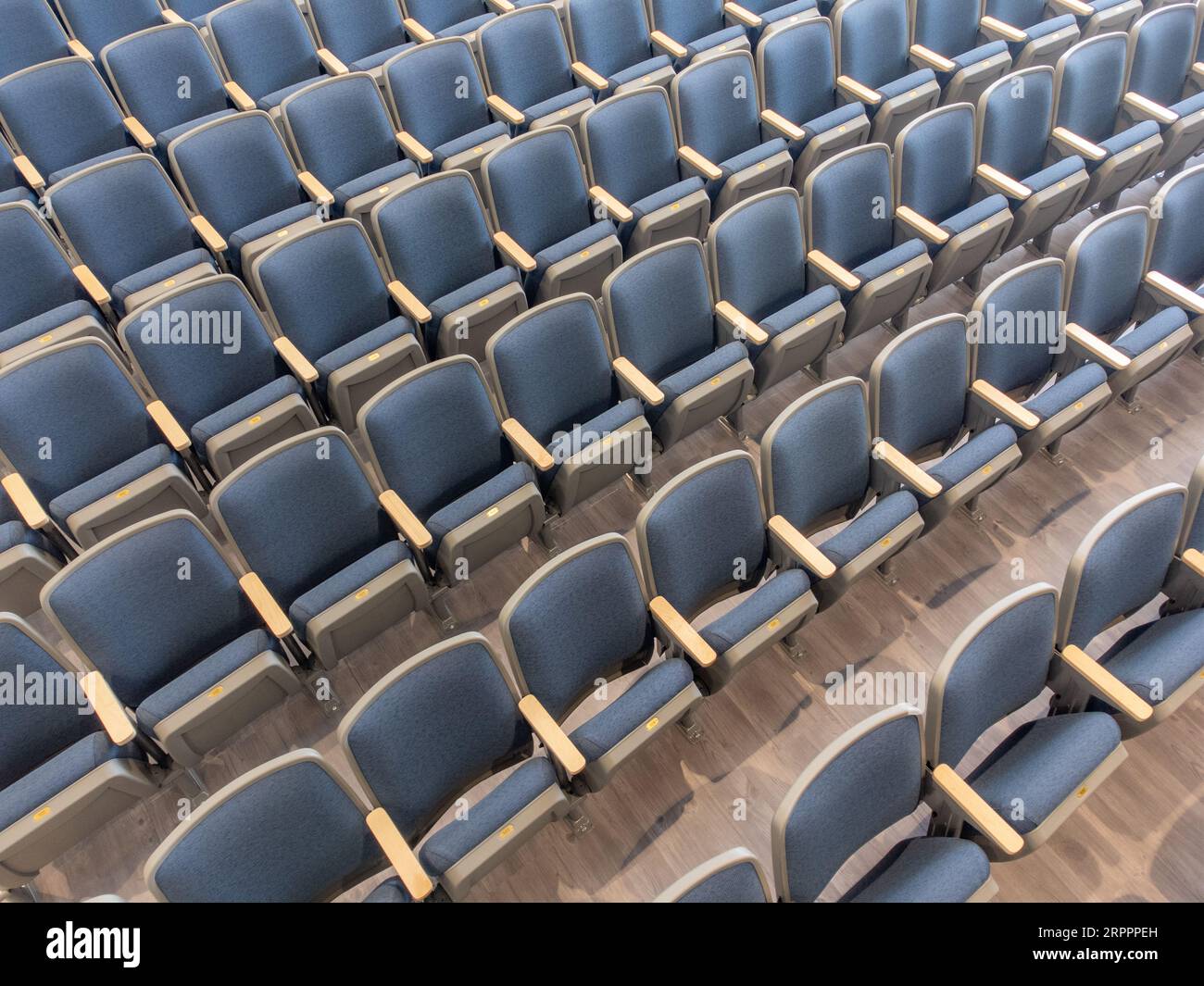 Overhead view of empty gray and blue theater, auditorium seats, chairs ...