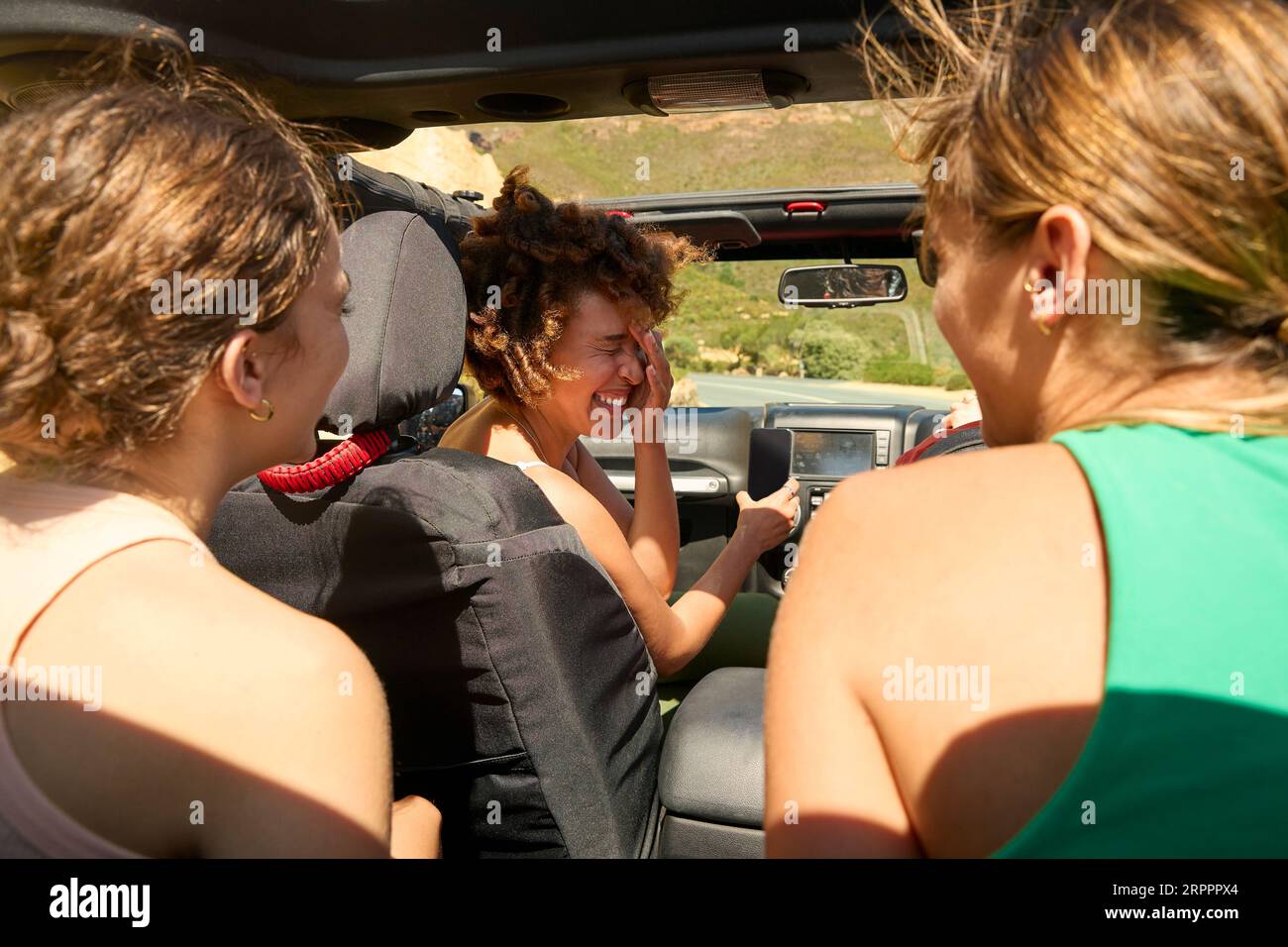 Four friends driving in open top car hi-res stock photography and ...