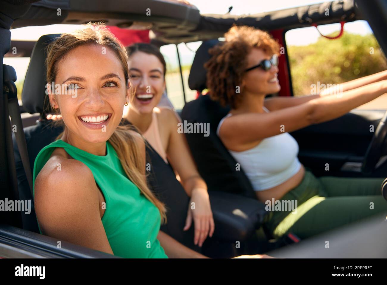 Four friends driving in open top car hi-res stock photography and ...