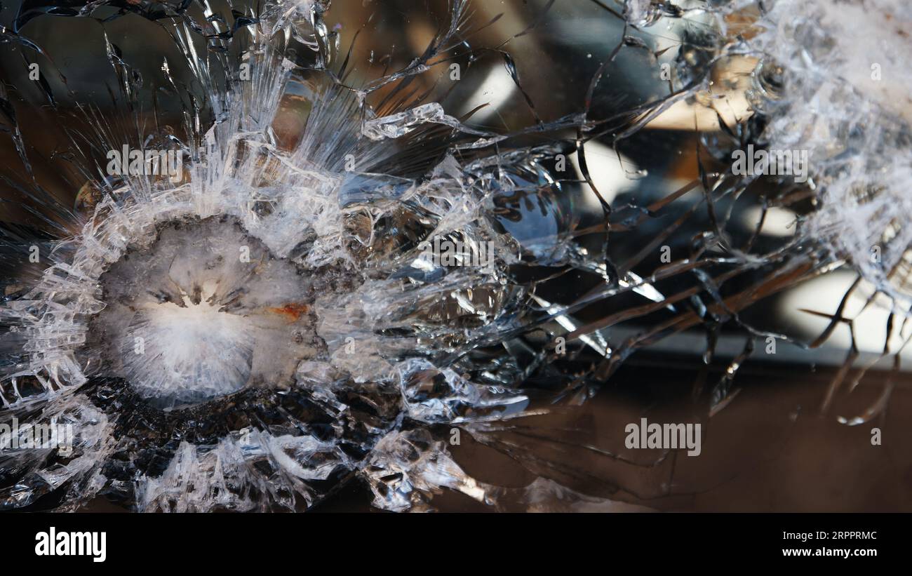 Bulletproof glass. Armored car after the shelling. Armored glass after ...