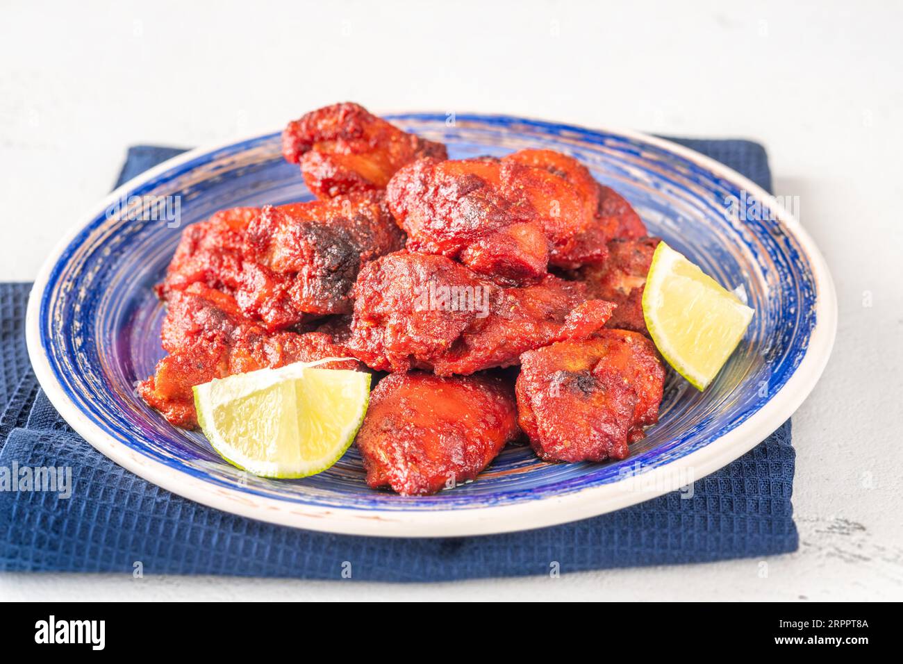 Portion of Chicken tikka spicy indian boneless chicken dish Stock Photo ...