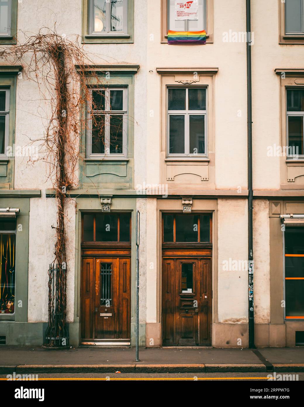 An old city building with traditional wooden doors and windows is ...