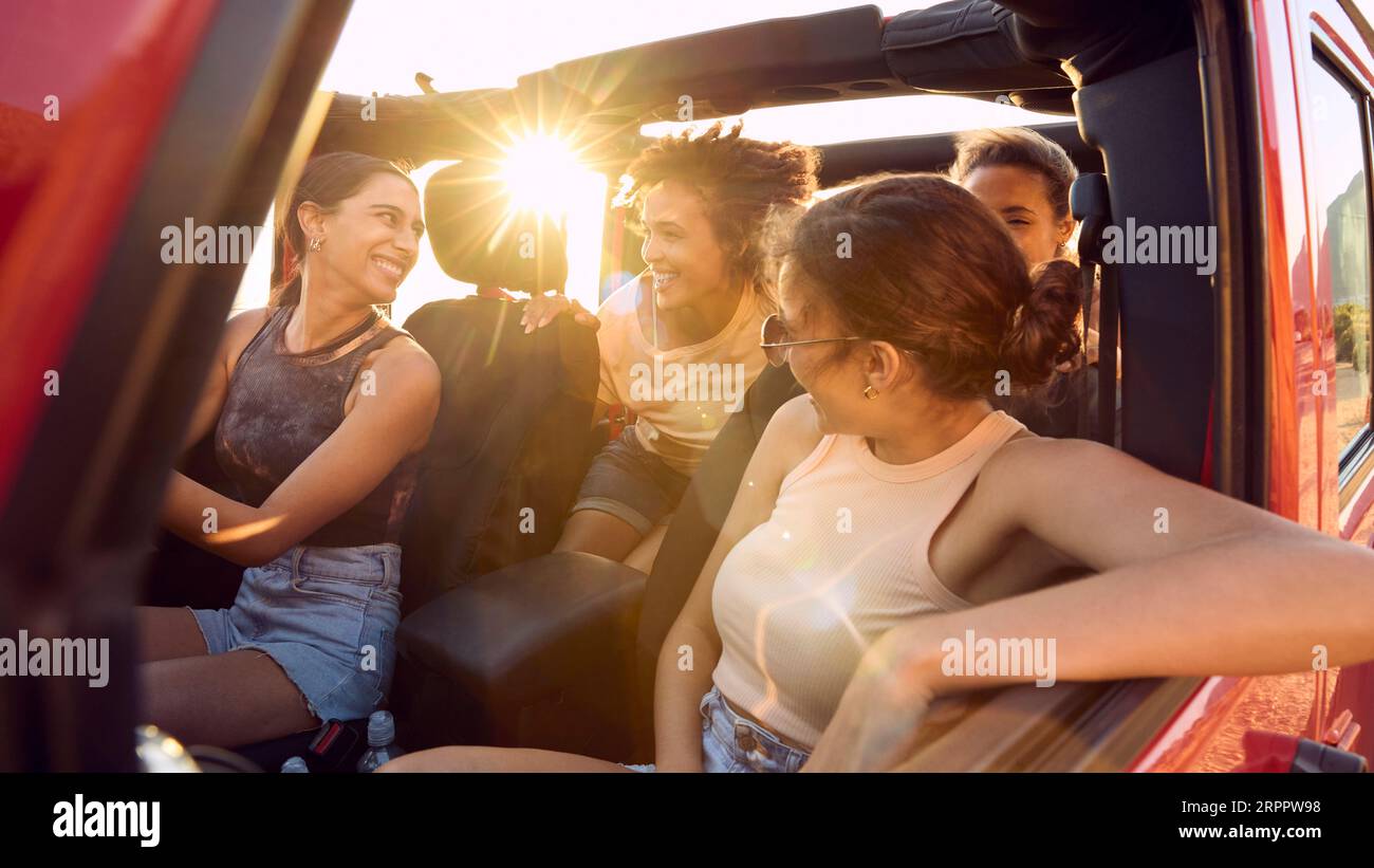 Four friends driving in open top car hi-res stock photography and ...