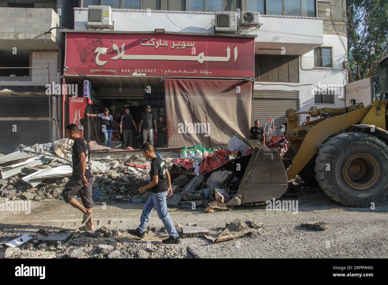 Tulkarm, Palestine. 05th Sep, 2023. Palestinians inspect a damaged ...