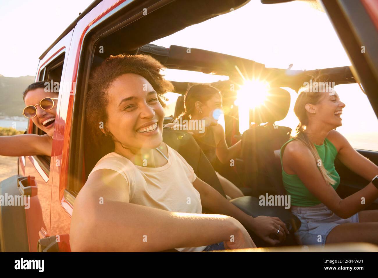 Four friends driving in open top car hi-res stock photography and ...