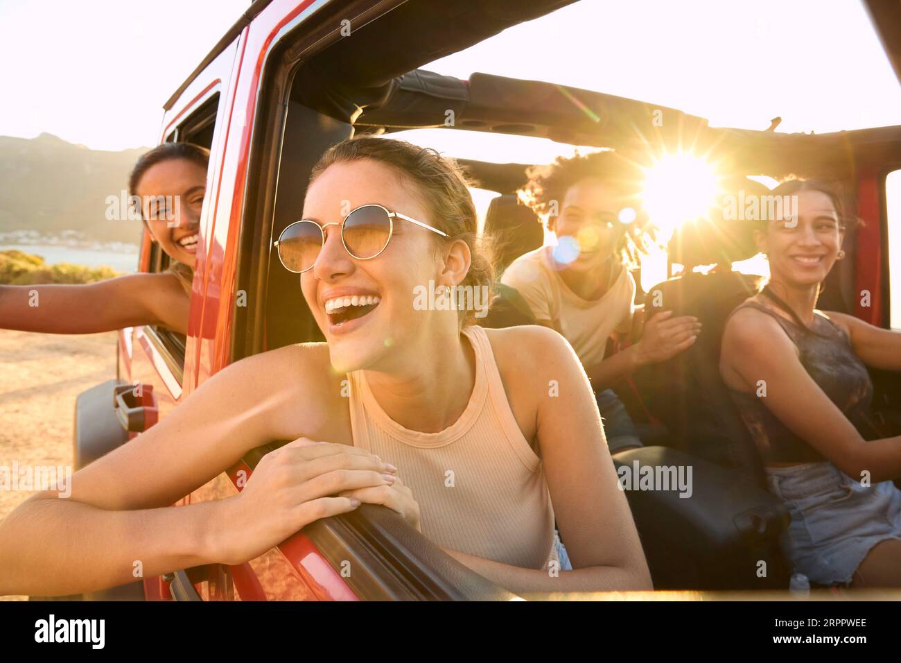 Four friends driving in open top car hi-res stock photography and ...