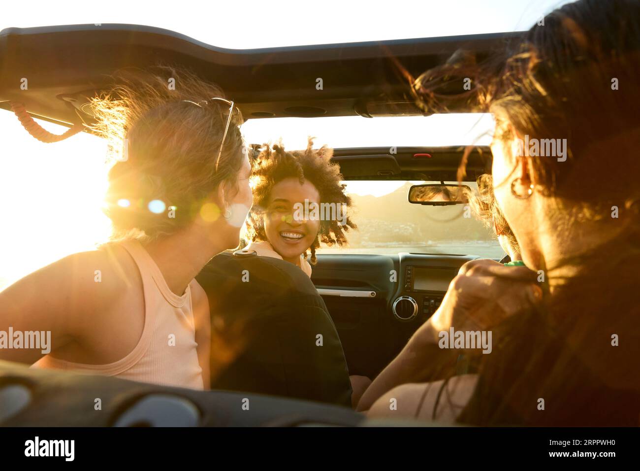 Four friends driving in open top car hi-res stock photography and ...