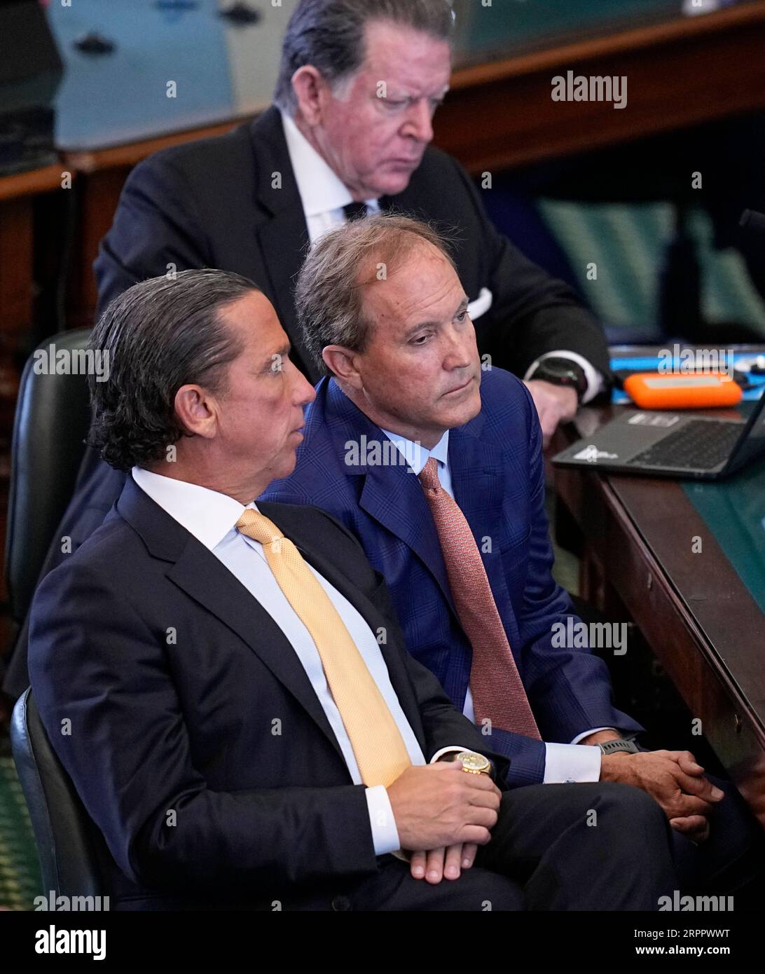 Texas state Attorney General Ken Paxton, center, sits with his ...