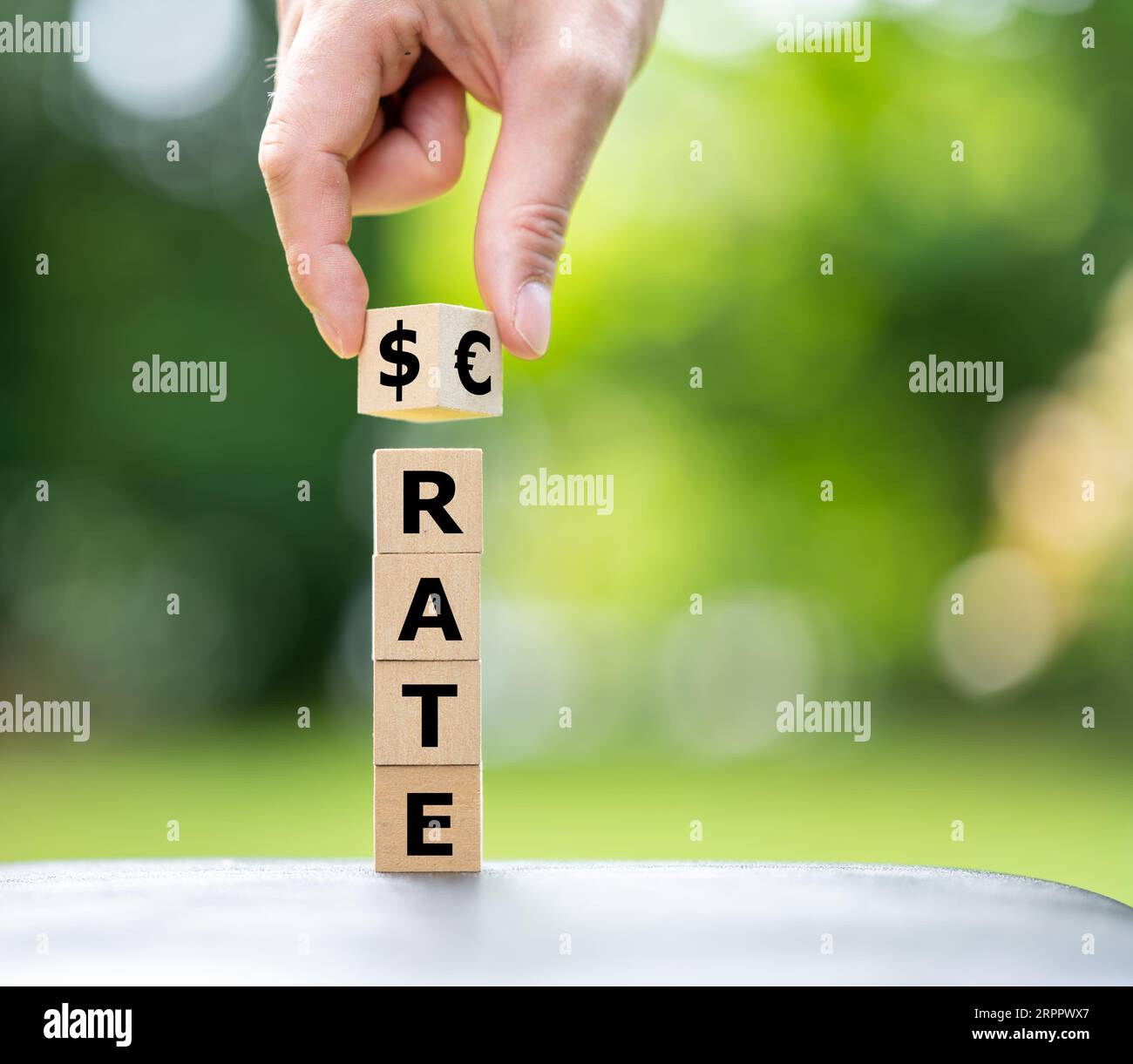 Stack of wooden cubes forms the expression 'euro dollar rate'. Symbol ...