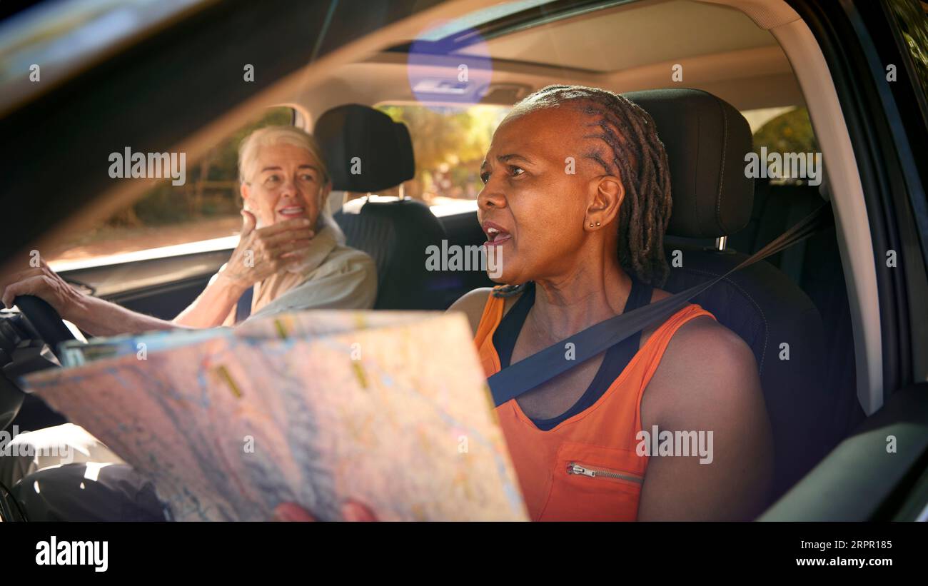 Two Confused Senior Female Friends On Day Trip Out Driving In Car ...