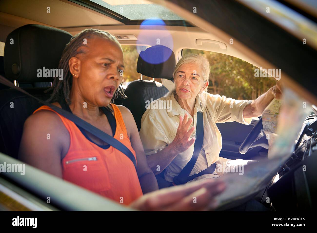 Two Confused Senior Female Friends On Day Trip Out Driving In Car ...