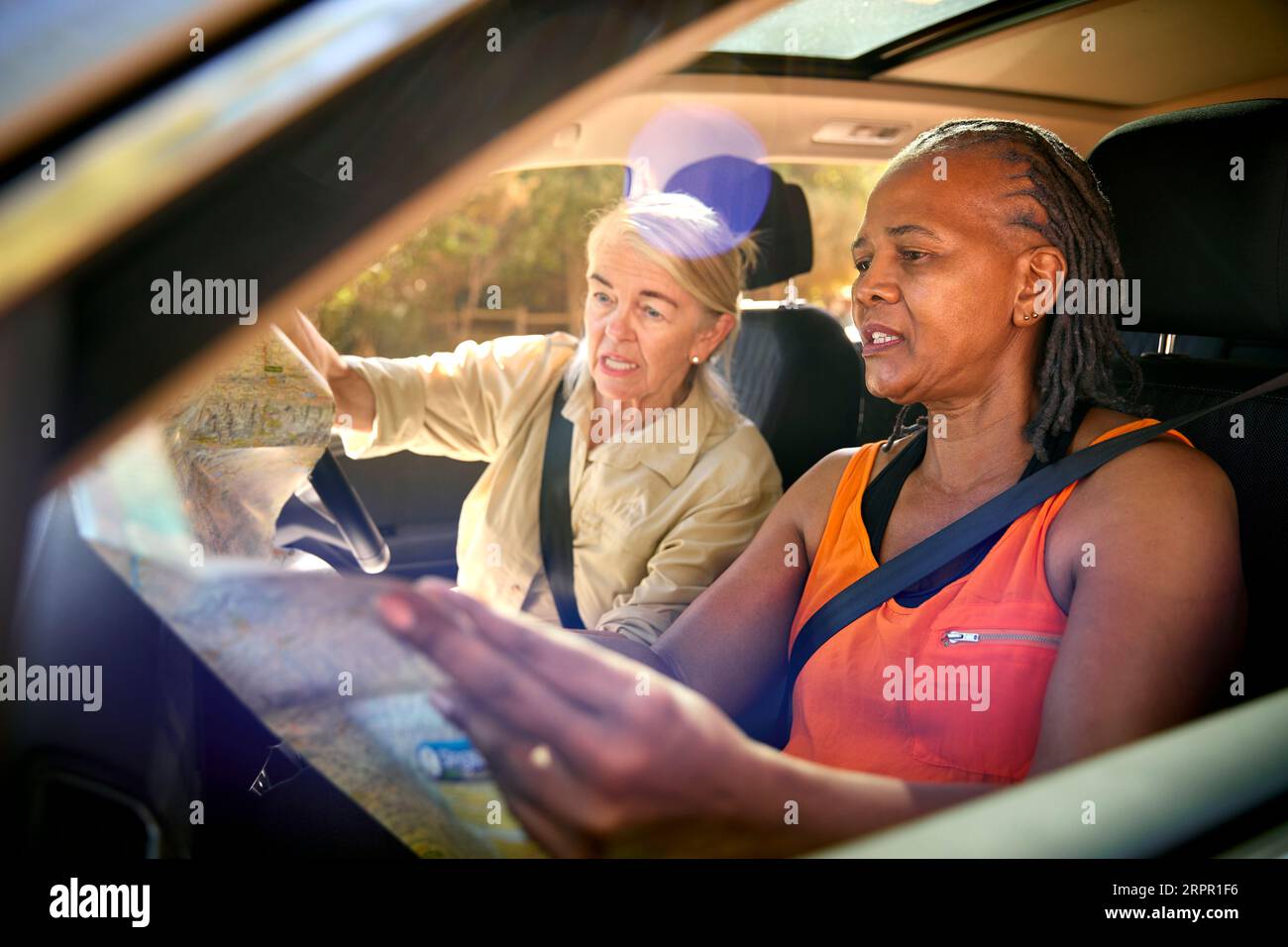 Two Confused Senior Female Friends On Day Trip Out Driving In Car ...