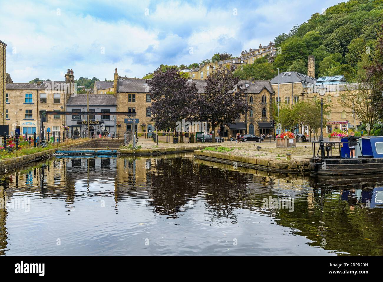 Rochdale canal runs though Hebden Bridge. The River Calder combines ...