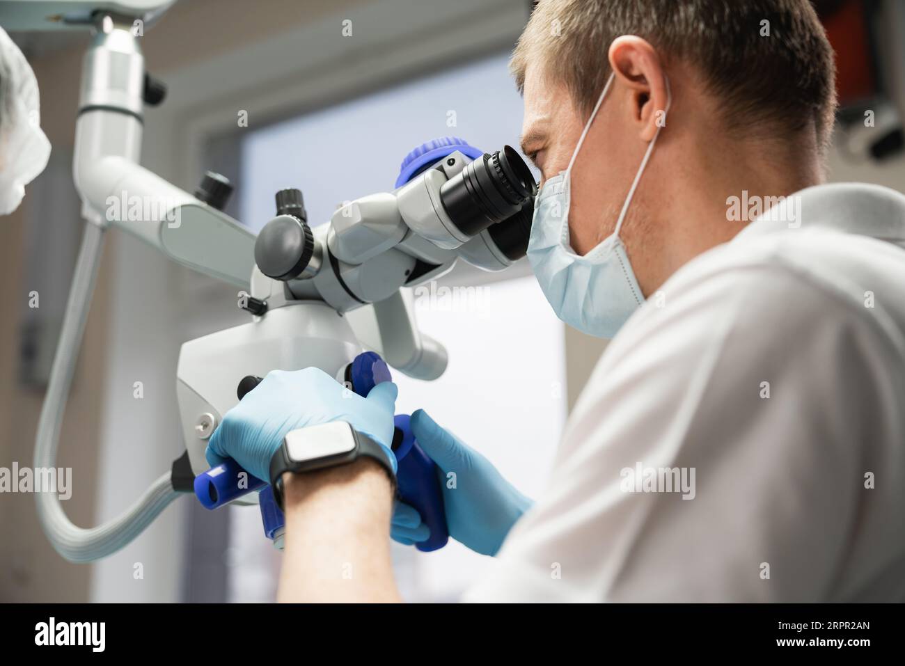 Dentist makes an operation using a dental microscope Stock Photo - Alamy