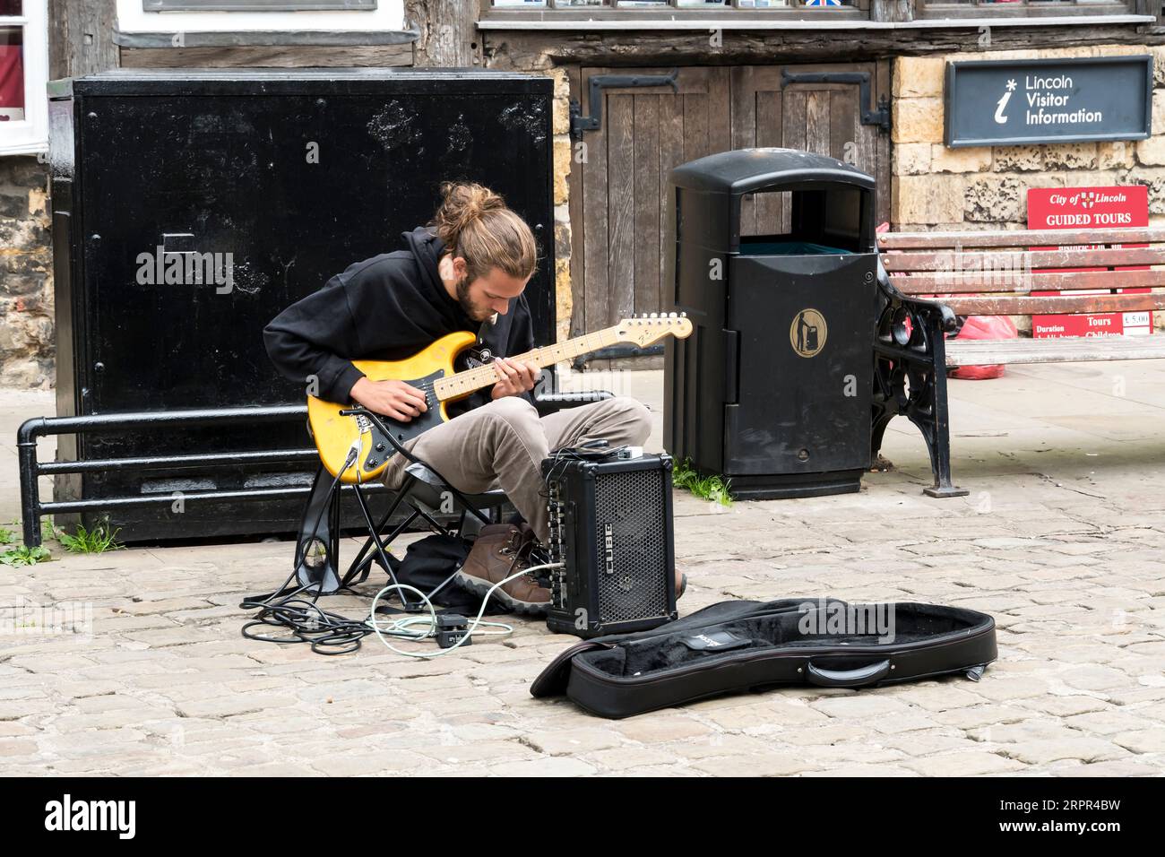 Street entertainer playing Fender Stratocaster guitar, Castle Hill ...