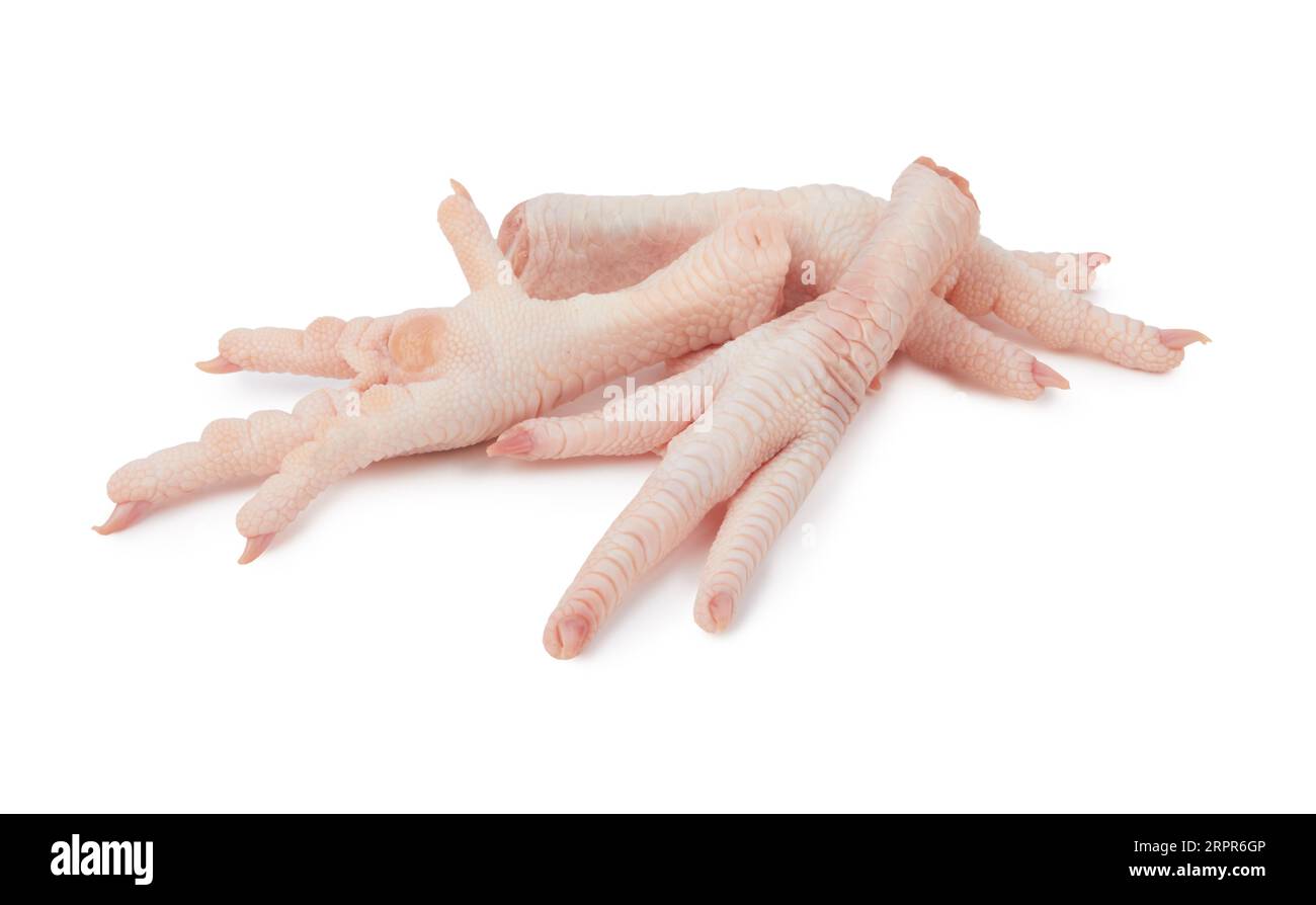 Raw chicken feet isolated on white background Stock Photo - Alamy