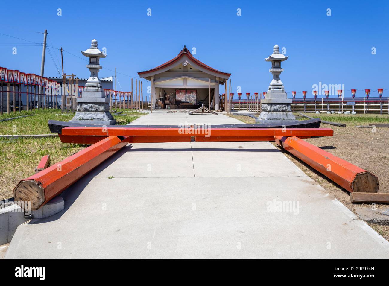 A traditional red toori gate being prepared for the Kanaiwa Summer ...