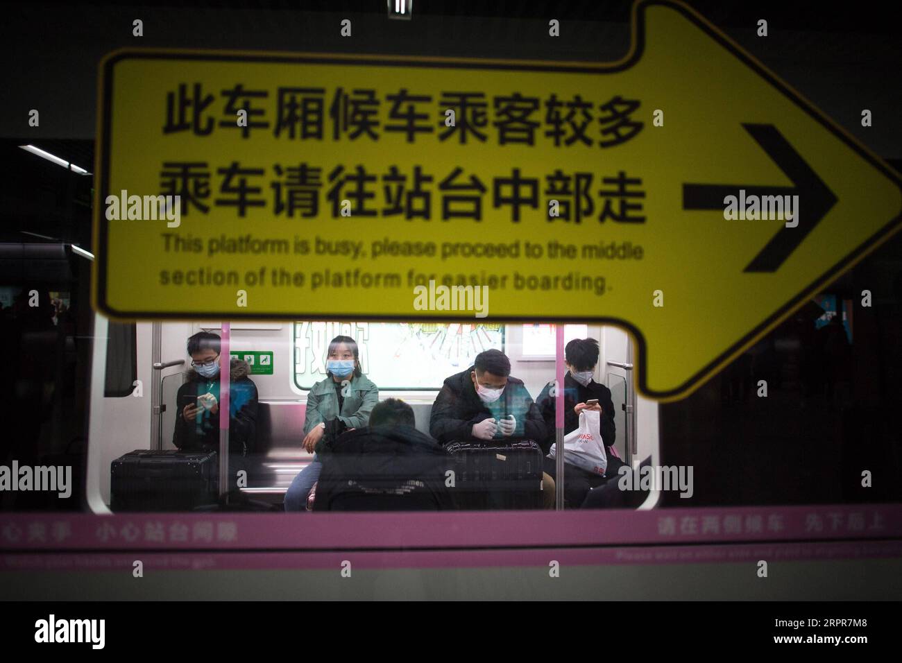 200328 -- WUHAN, March 28, 2020 -- Passengers are seen on a train of ...