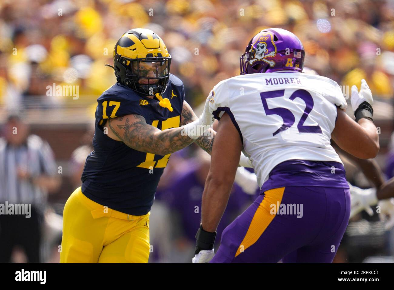 Michigan defensive end Braiden McGregor (17) rushes against East ...