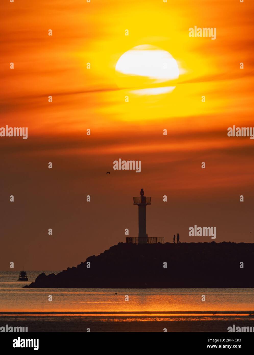 Howth sunrise from Claremont Beach Stock Photo - Alamy