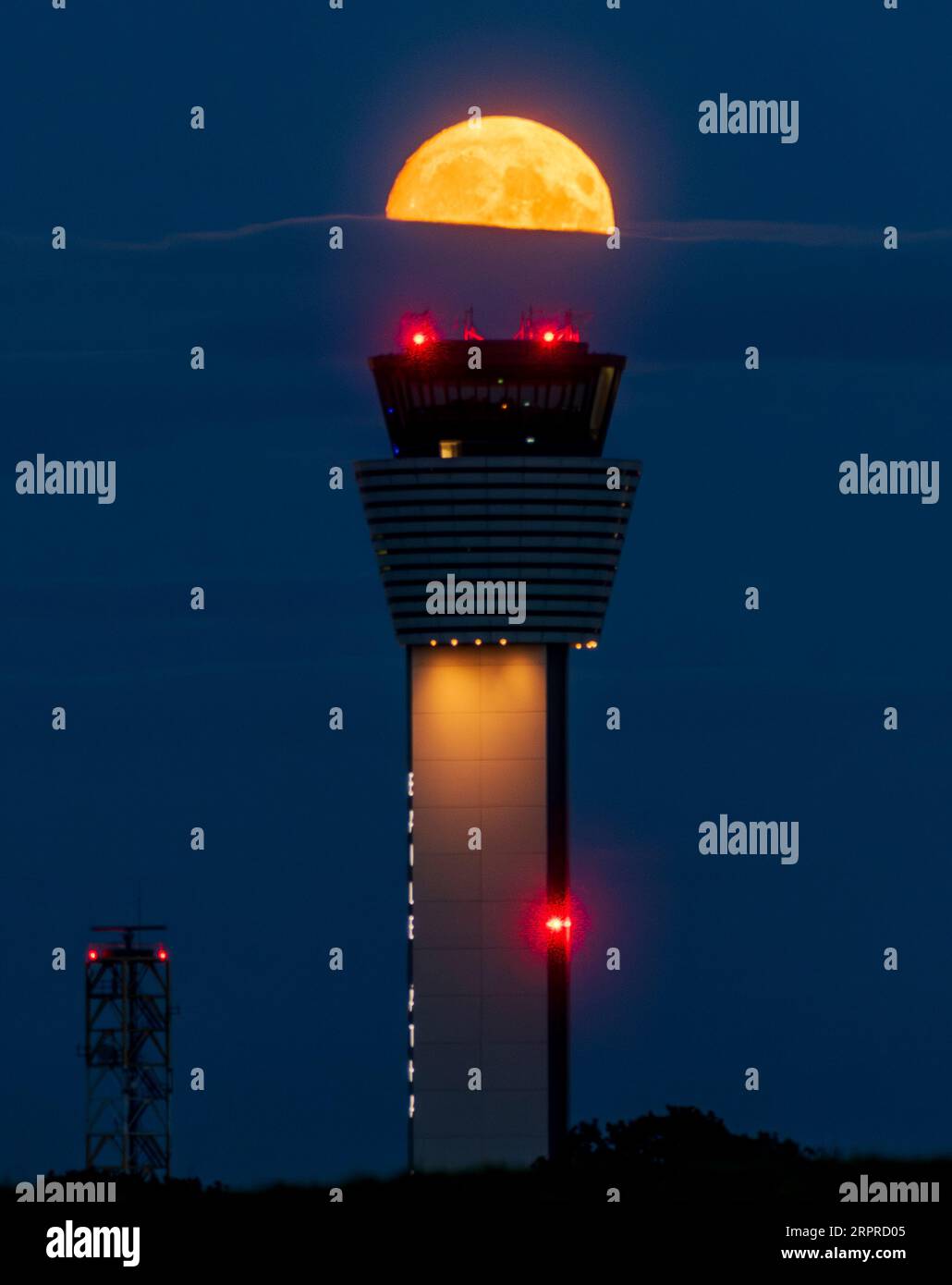 The super blue moon rising above the Dublin Airport air traffic control ...