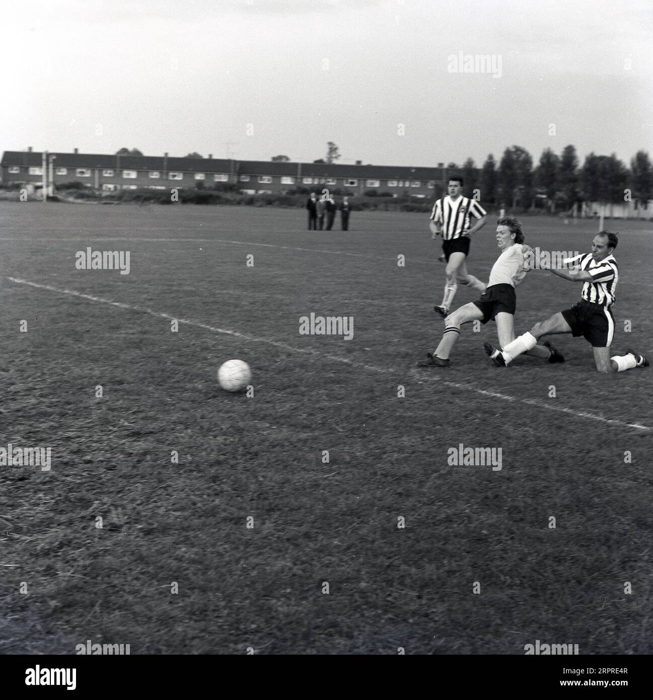 1964, historical, amateur football, outside on a pitch, two players ...