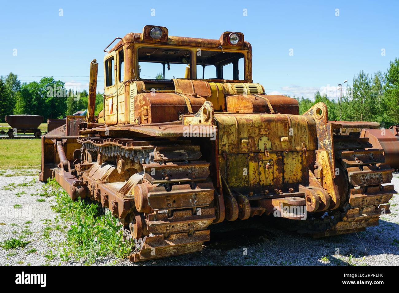 Rear view of big rusty old huge heavy crawler bulldozer, abandoned ...