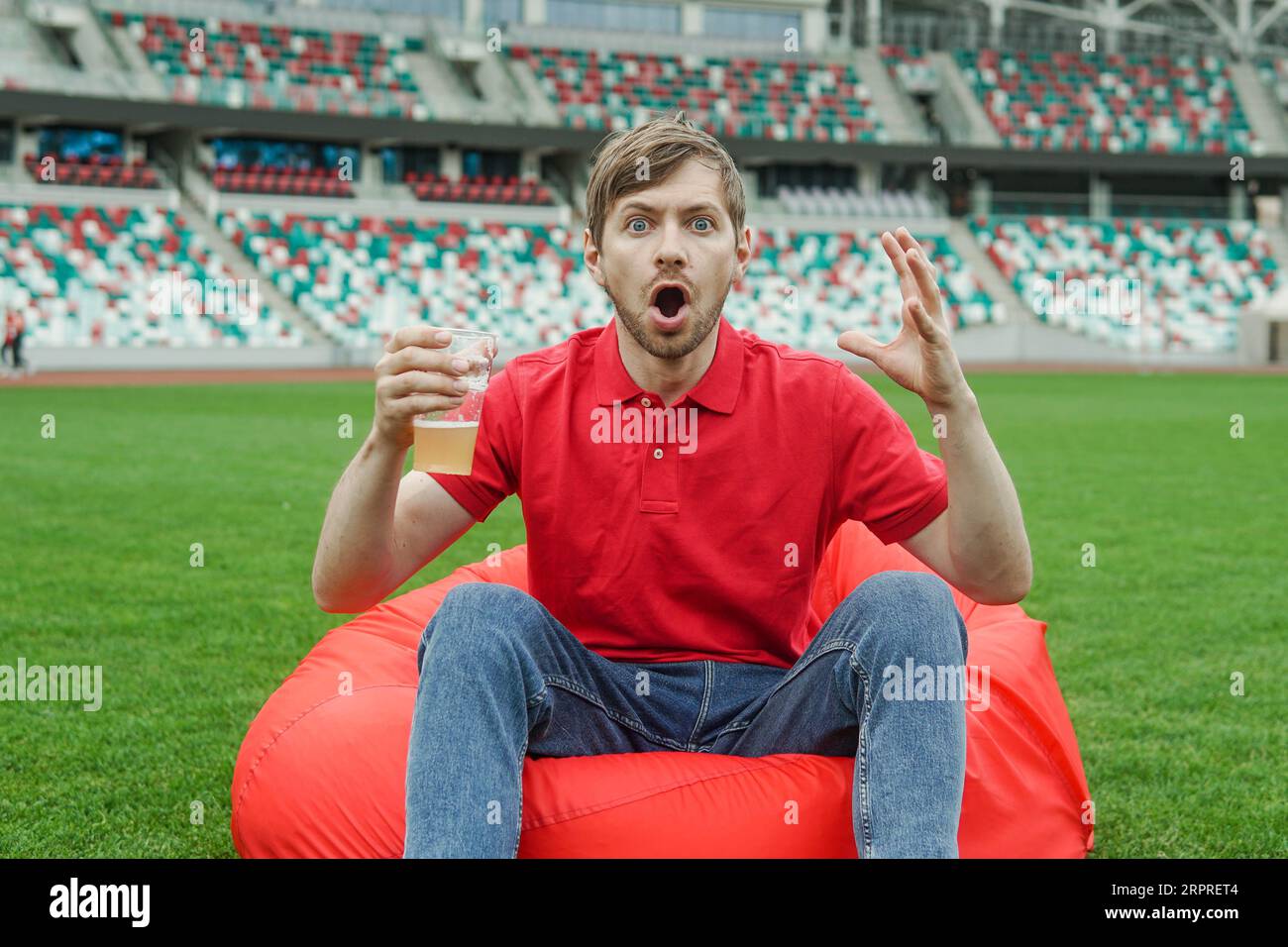 Shocked Soccer Fan in Red Tshirt With Glass of Beer Watching Football ...