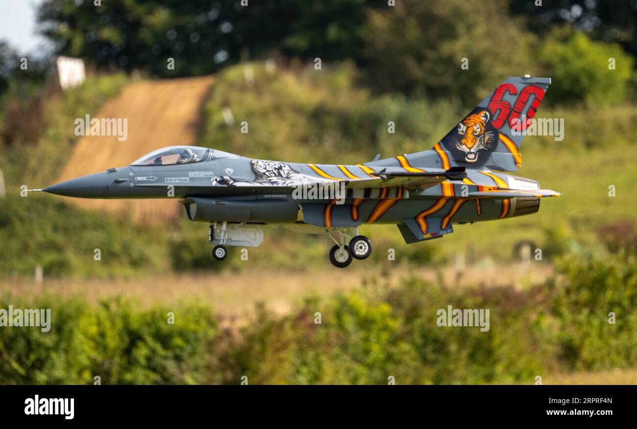 Wheels down. A radio-controlled model jet plane comes into land at ...