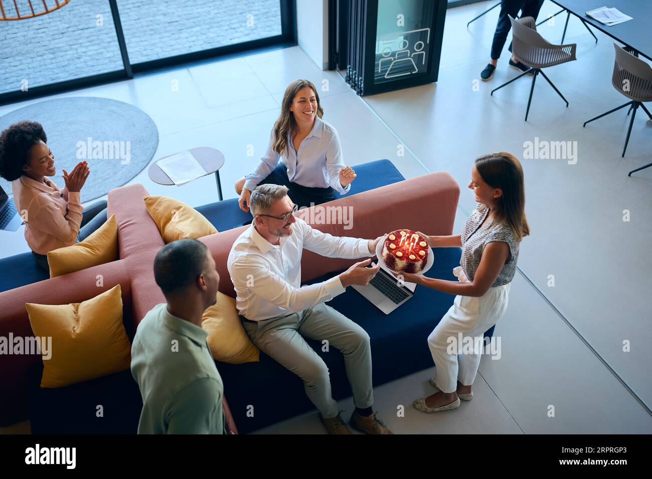 Staff Celebrating Birthday Of Male Colleague In Multi Cultural Open ...