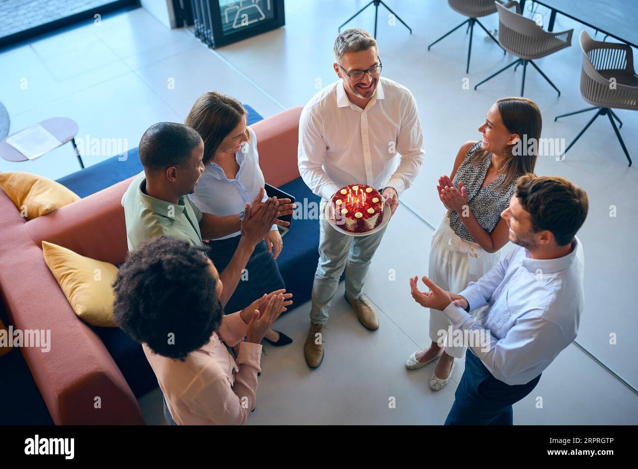 Staff Celebrating Birthday Of Male Colleague In Multi Cultural Open ...