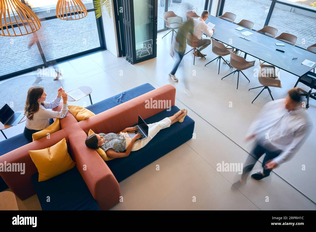 Overhead View Of Modern Open Plan Office With Staff Working Around ...