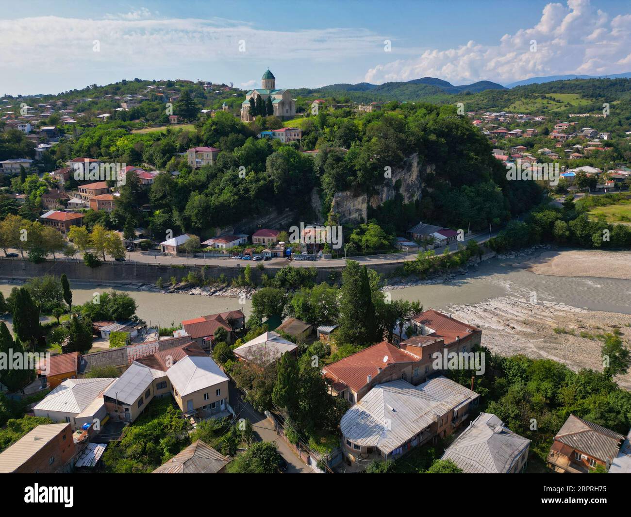 Aerial view from a helicopter of a small rural village in the distance ...