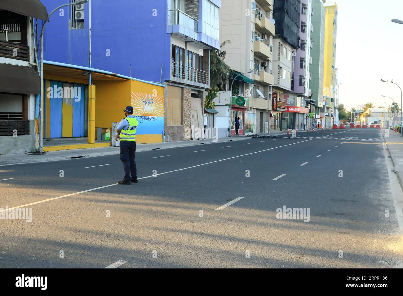 200404 -- MALE, April 4, 2020 -- A policeman is seen on duty at an ...