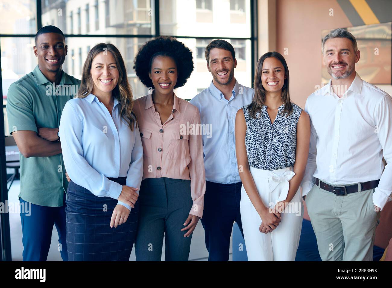 Smiling multi cultural business team hi-res stock photography and ...