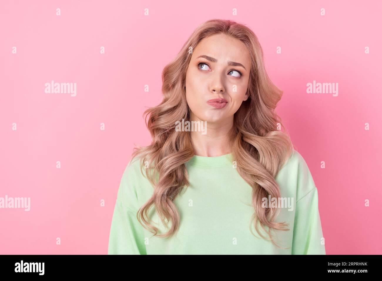 Portrait of young funny girl blonde curly hair thoughtful contemplation ...