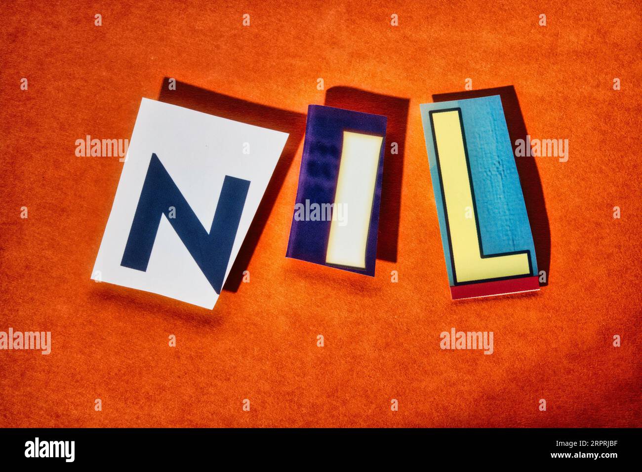 The acronym "NIL" (Name, image, likeness) using cut-out paper letters ...