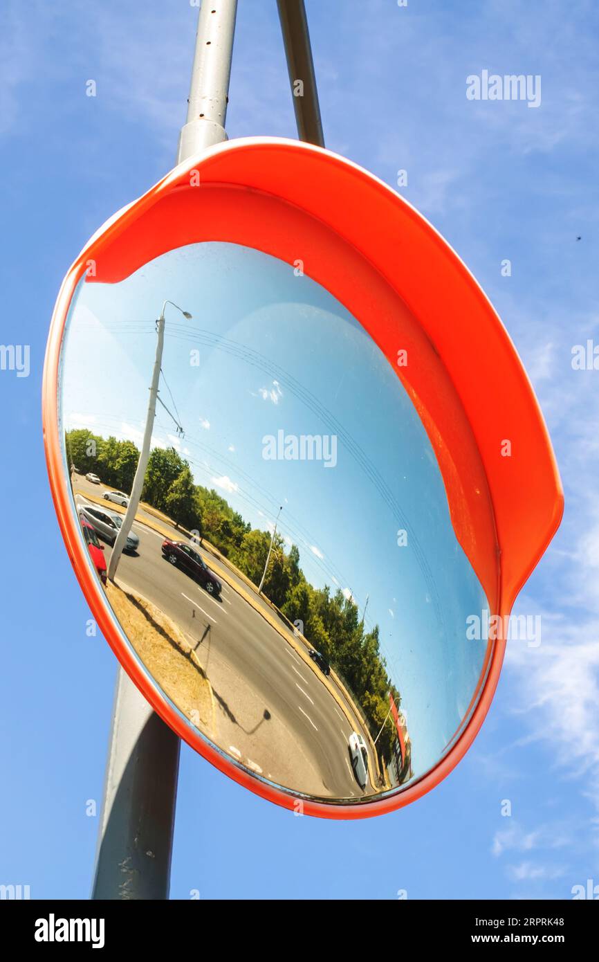 Spherical Road Mirror on blue sky background close up Stock Photo - Alamy