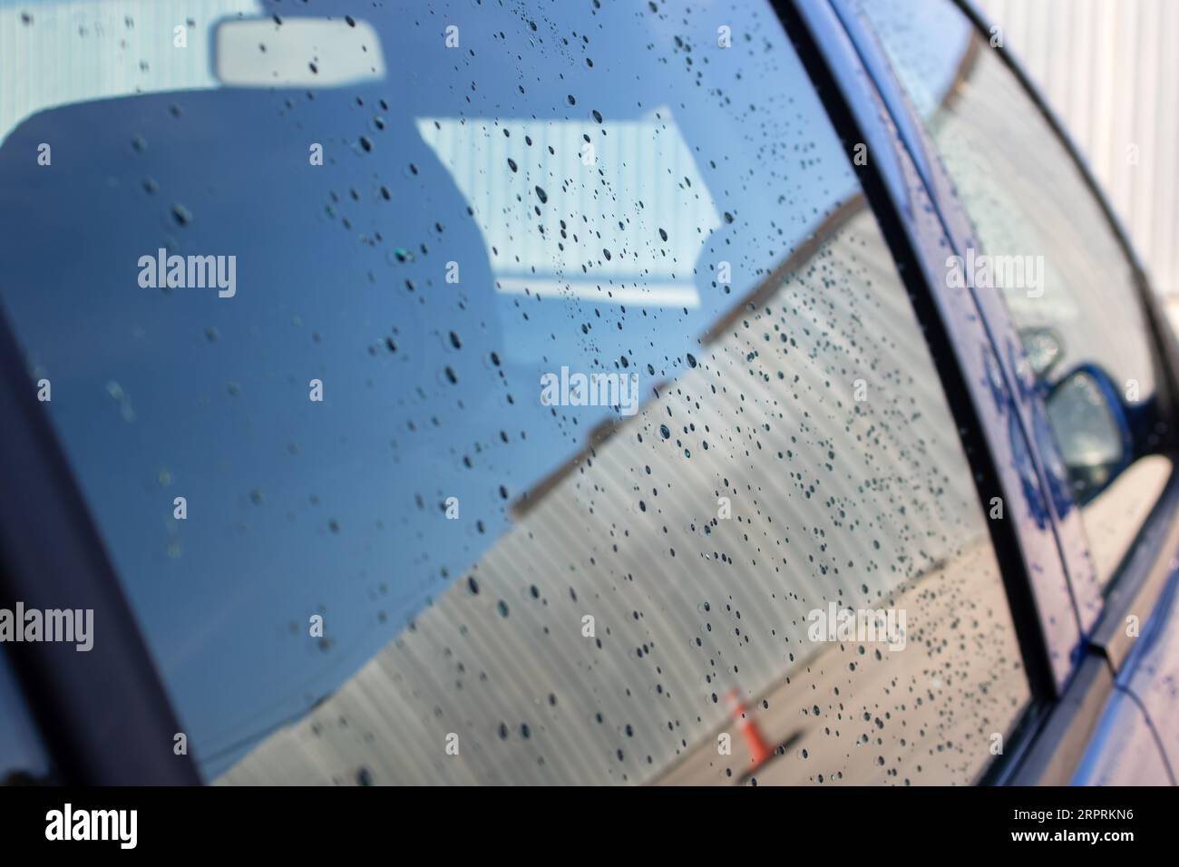 Water droplets on the side window of a car Stock Photo - Alamy