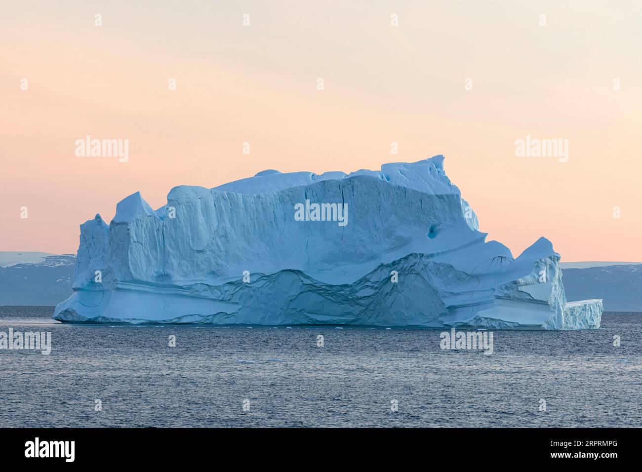 Impressive floating iceberg in Disko Bay in the arctic early morning ...