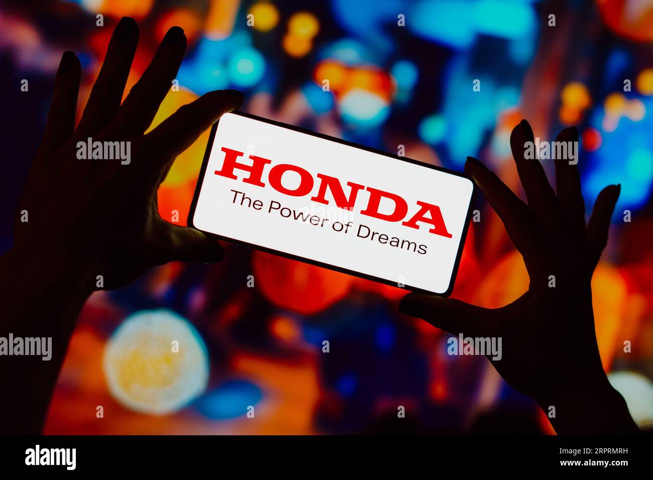 In this photo illustration, the Honda logo is displayed on a smartphone ...