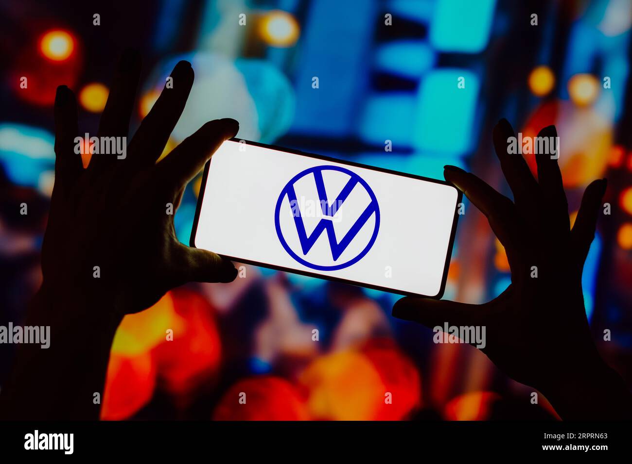 In this photo illustration, the Volkswagen (VW) logo is displayed on a ...