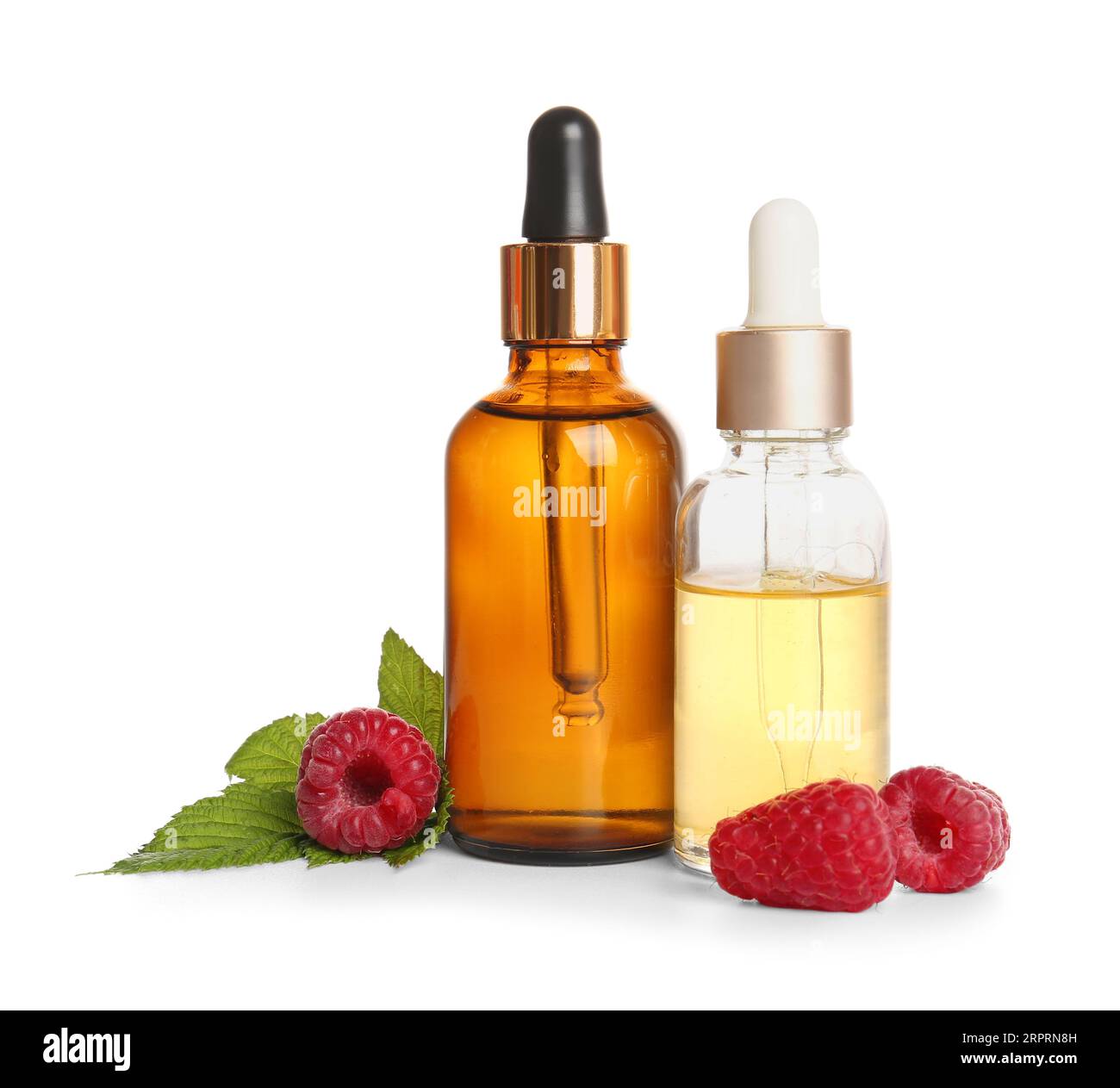 Bottles of cosmetic raspberry oil on white background Stock Photo - Alamy
