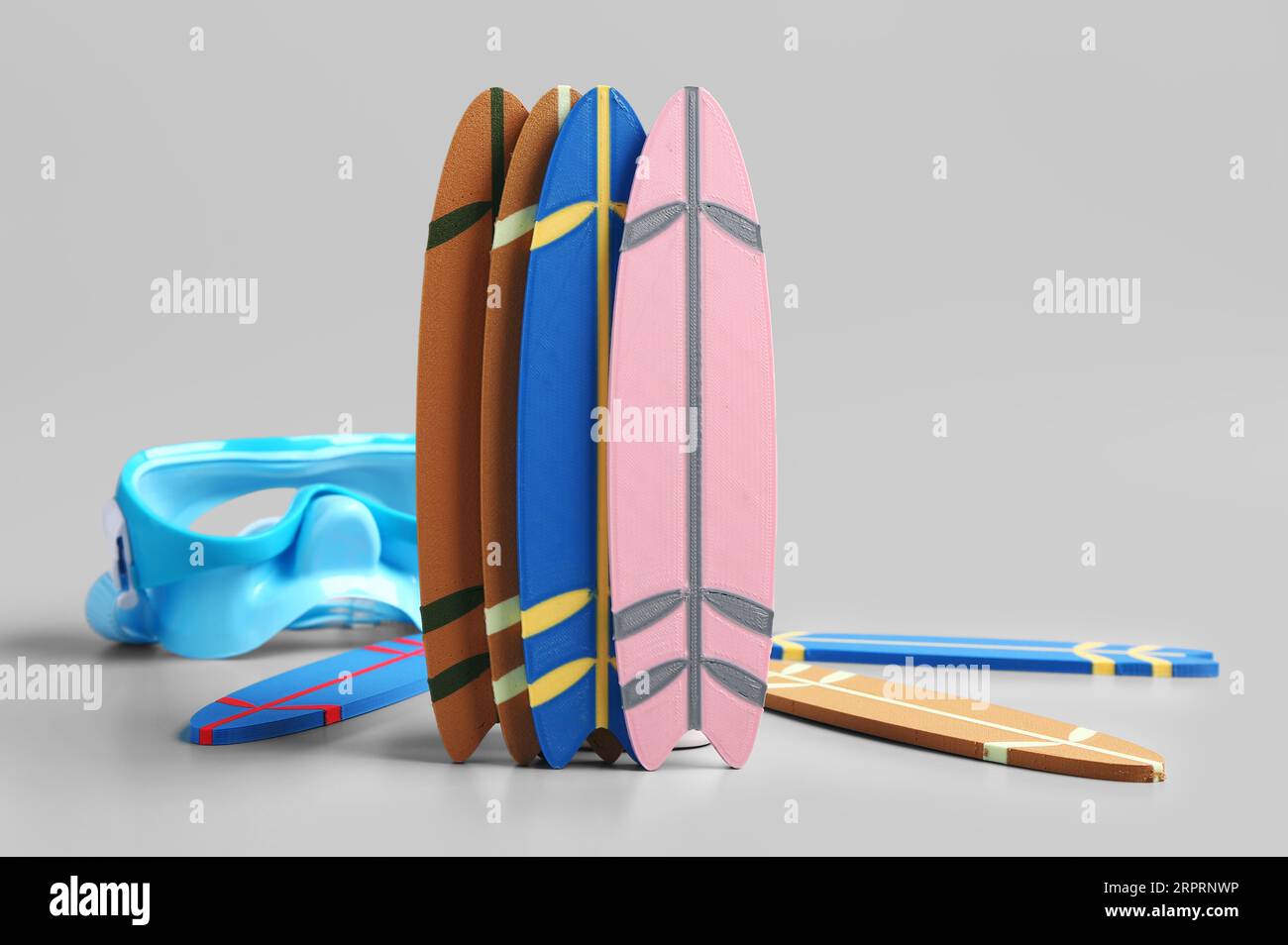 Different mini surfboards on grey background Stock Photo - Alamy
