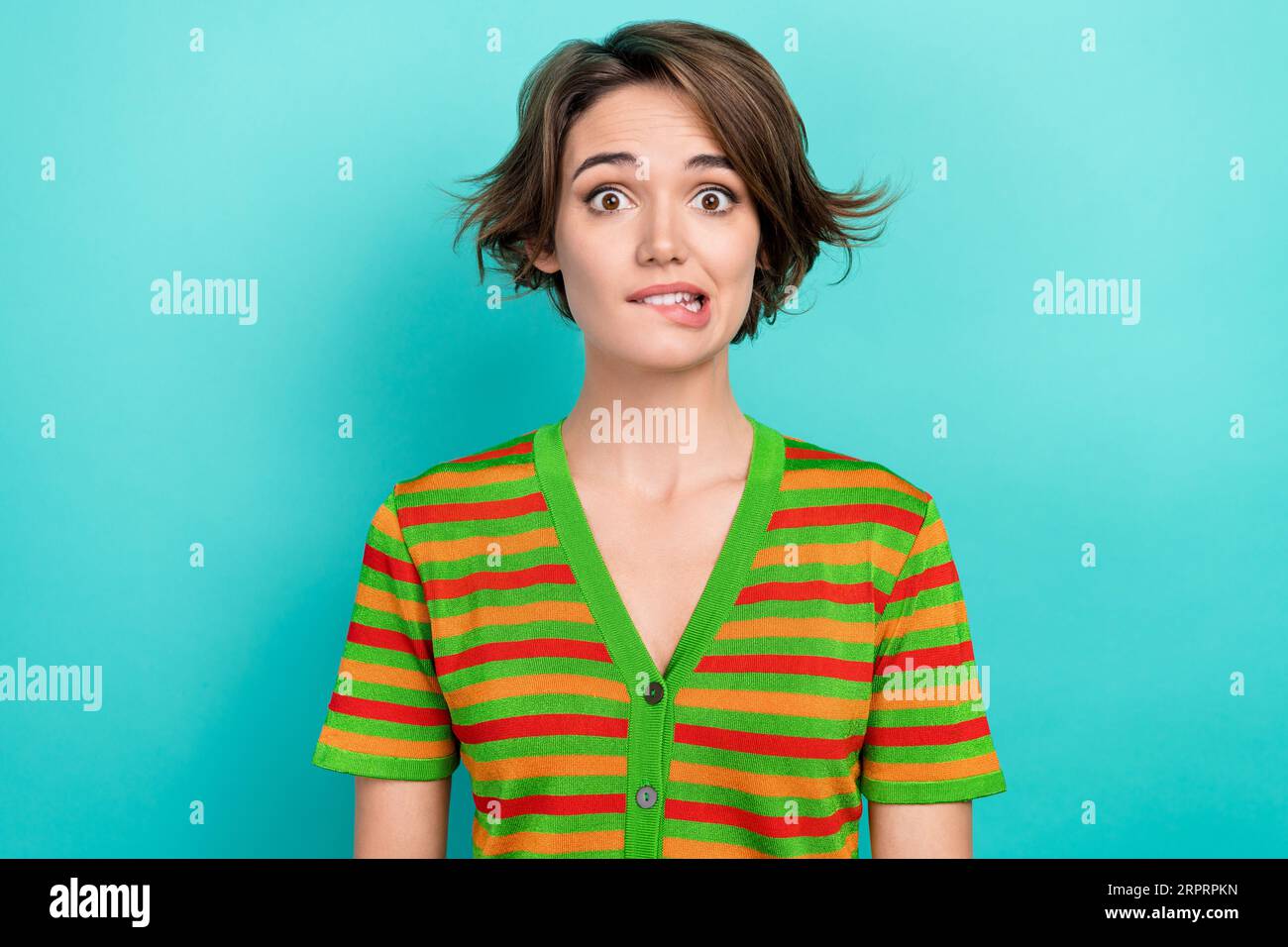 Portrait of nice worried young person biting lips doubt decide isolated ...