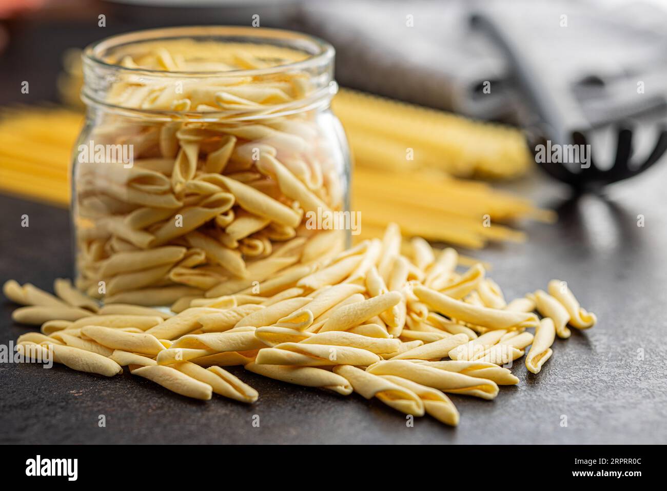 Fusilli pugliesi. Italian twisted pasta and spaghetti on the black ...