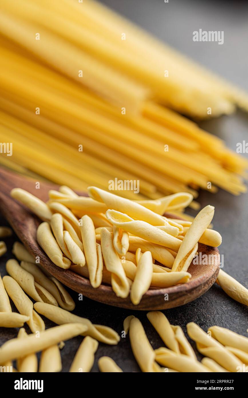 Fusilli pugliesi. Italian twisted pasta and spaghetti on the black ...
