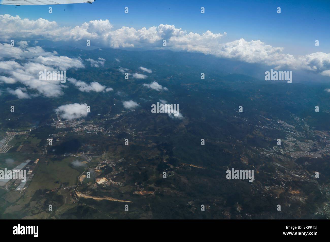Aerial view of the land from the airplane with clouds Stock Photo - Alamy