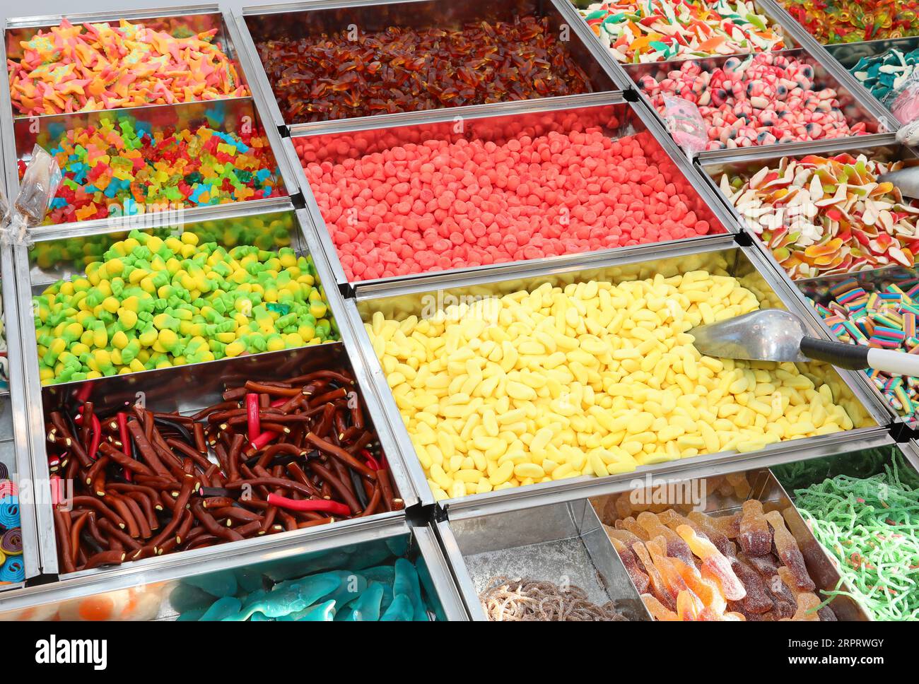 rich stall with lots of sugary candies and various sweets for sale in ...