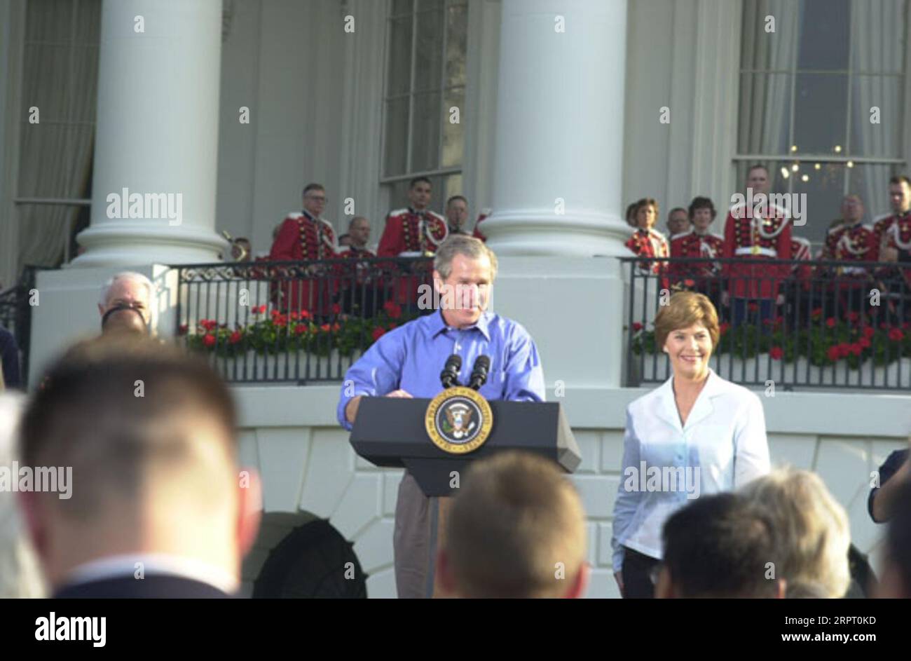 President George Bush, flanked by First Lady Laura Bush, disucssing the ...